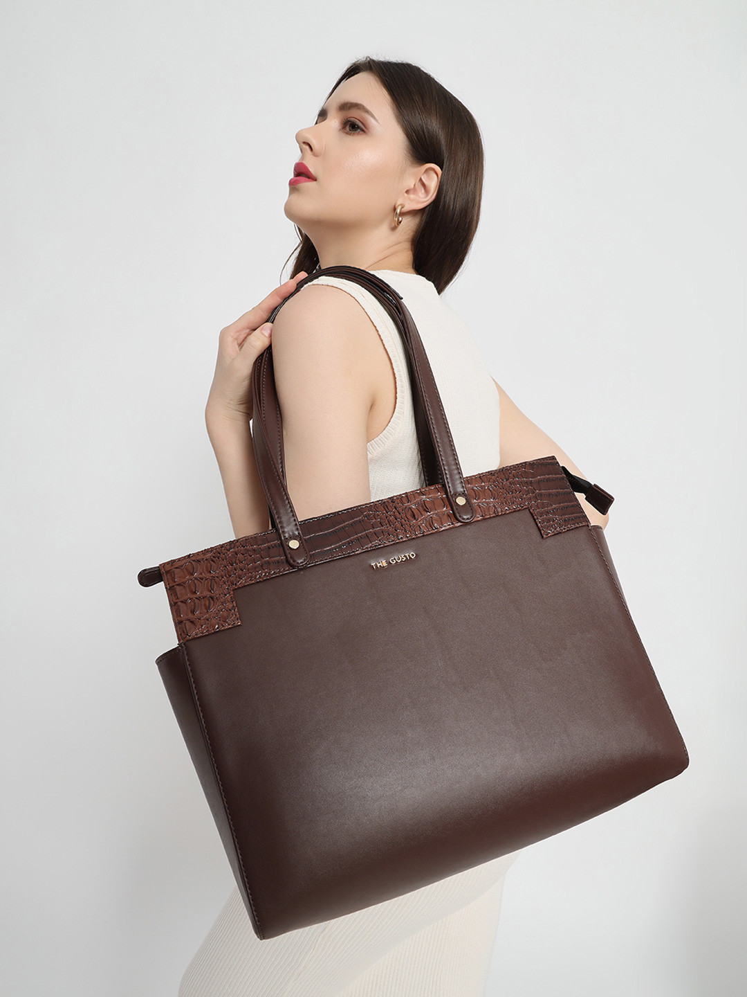 Buy THE GUSTO Textured PU Structured Tote Bag With Tasselled - Handbags for Women 30723572 | Myntra