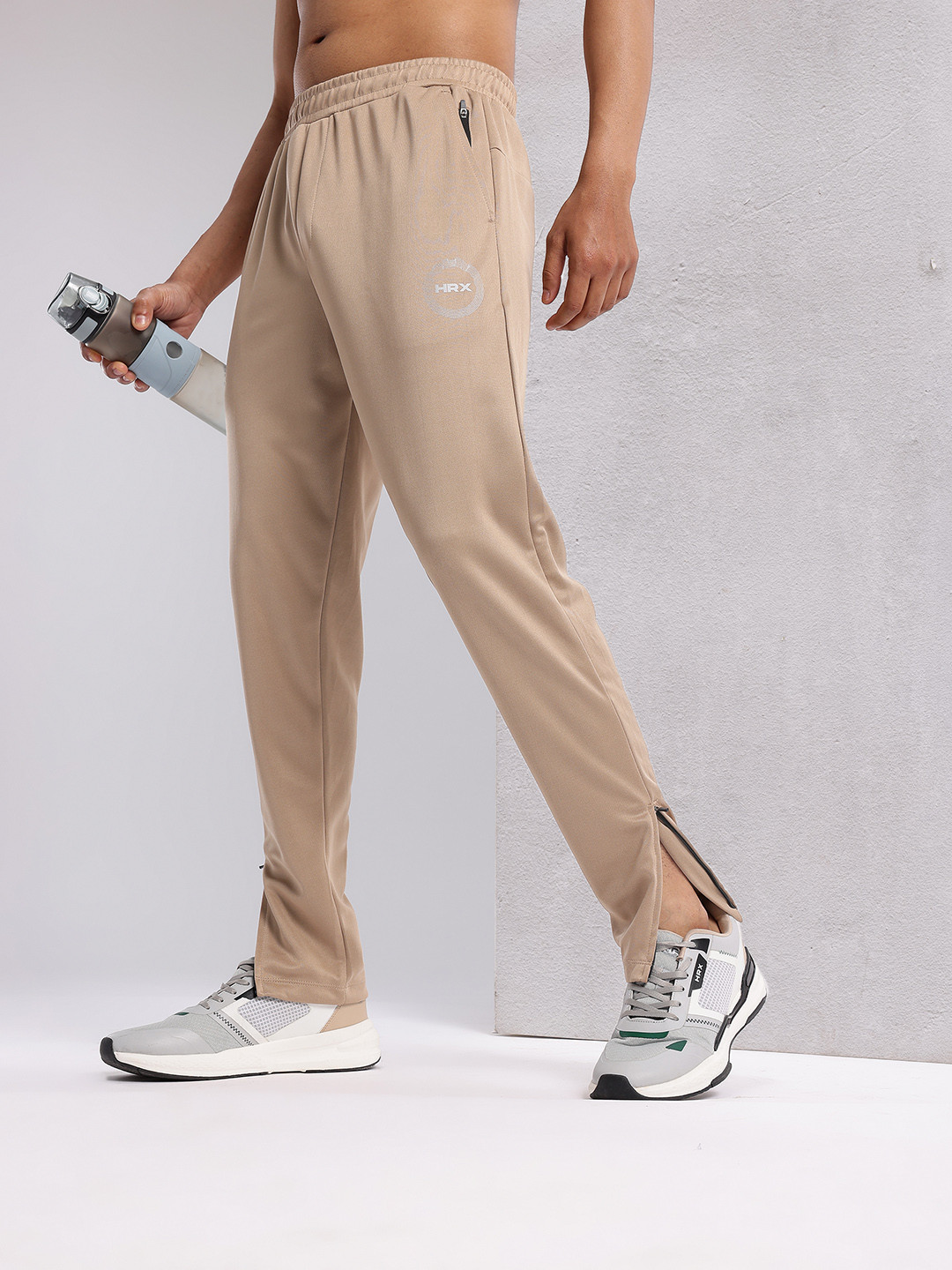 Buy HRX By Hrithik Roshan Men Zipped Hem Rapid Dry Running Track Pants ...