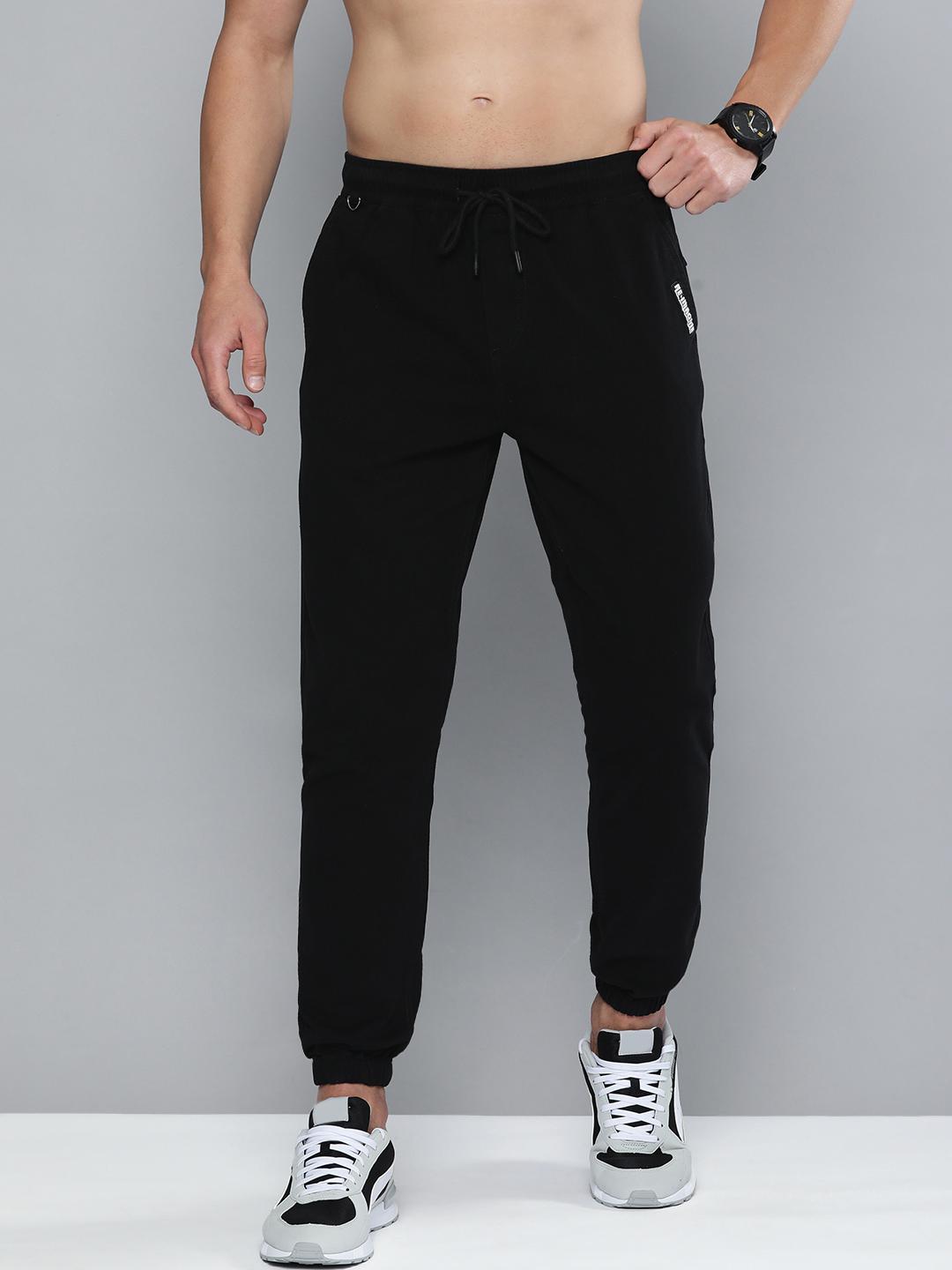 Buy HERE&NOW Men Black Solid Joggers Fit Trousers - Trousers for Men ...