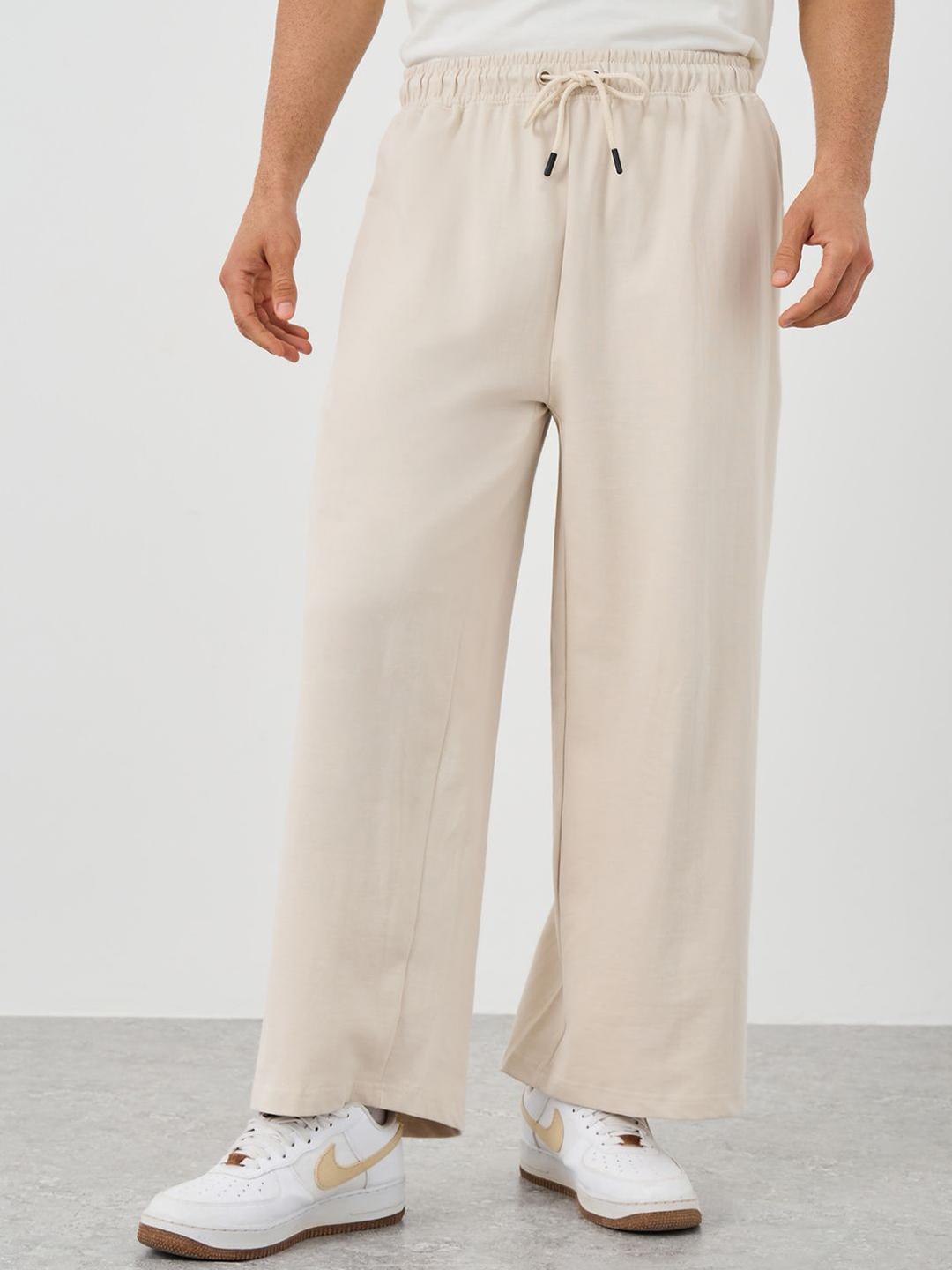 Buy Styli Men Cream Colored Solid Wide Leg Cotton Terry Casual Joggers ...