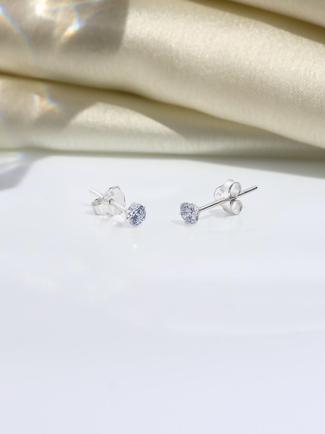 Buy HighSpark 92.5 Silver Cubic Zirconia Studded Round Studs Earrings ...