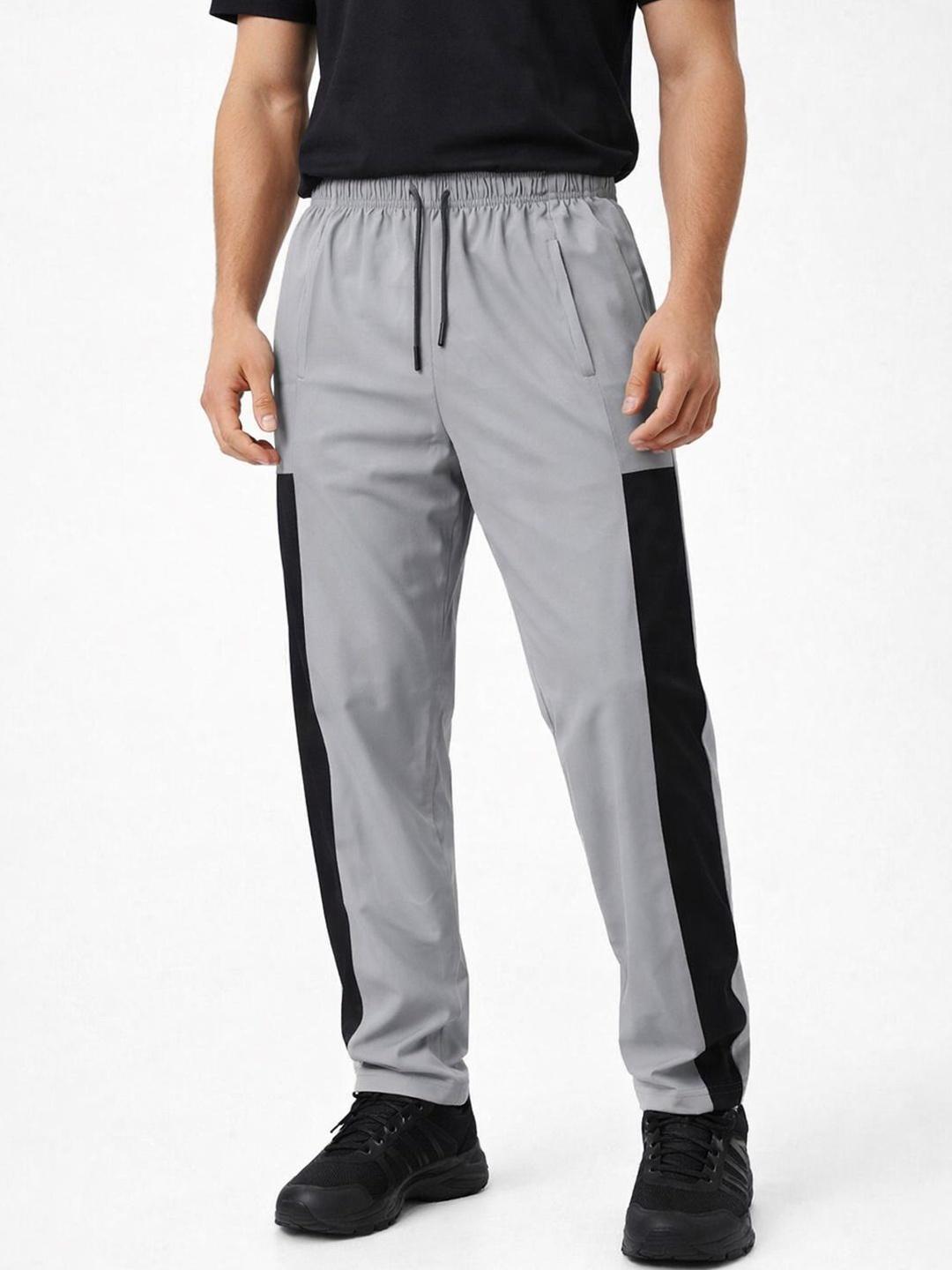 Buy SIMPLE SOLUTION Men Relaxed Fit Self Design Training Track Pants ...