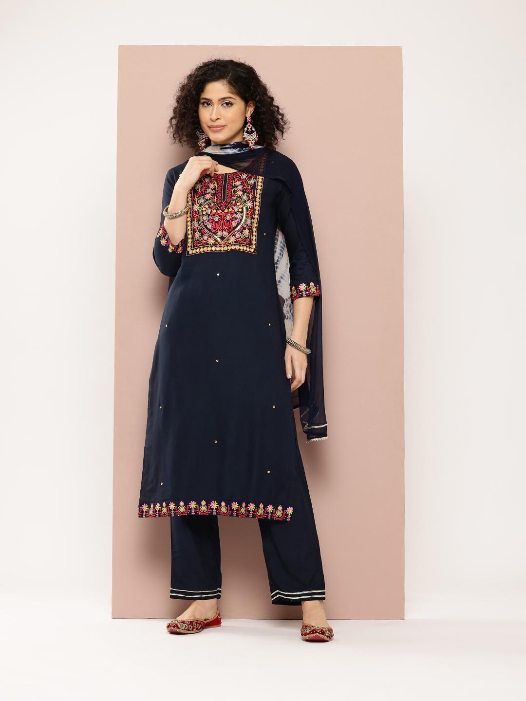 Buy PARTHVI Floral Embroidered Mirror Work Kurta With Trousers ...