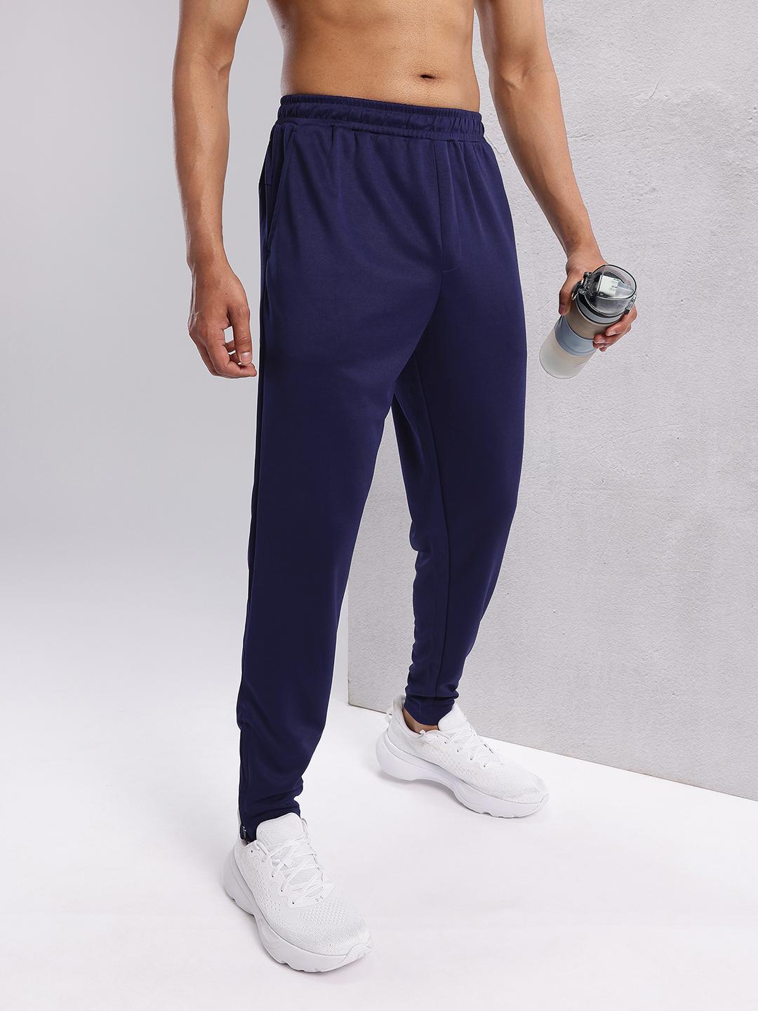Buy HRX By Hrithik Roshan Men Zipped Hem Rapid Dry Running Track Pants ...
