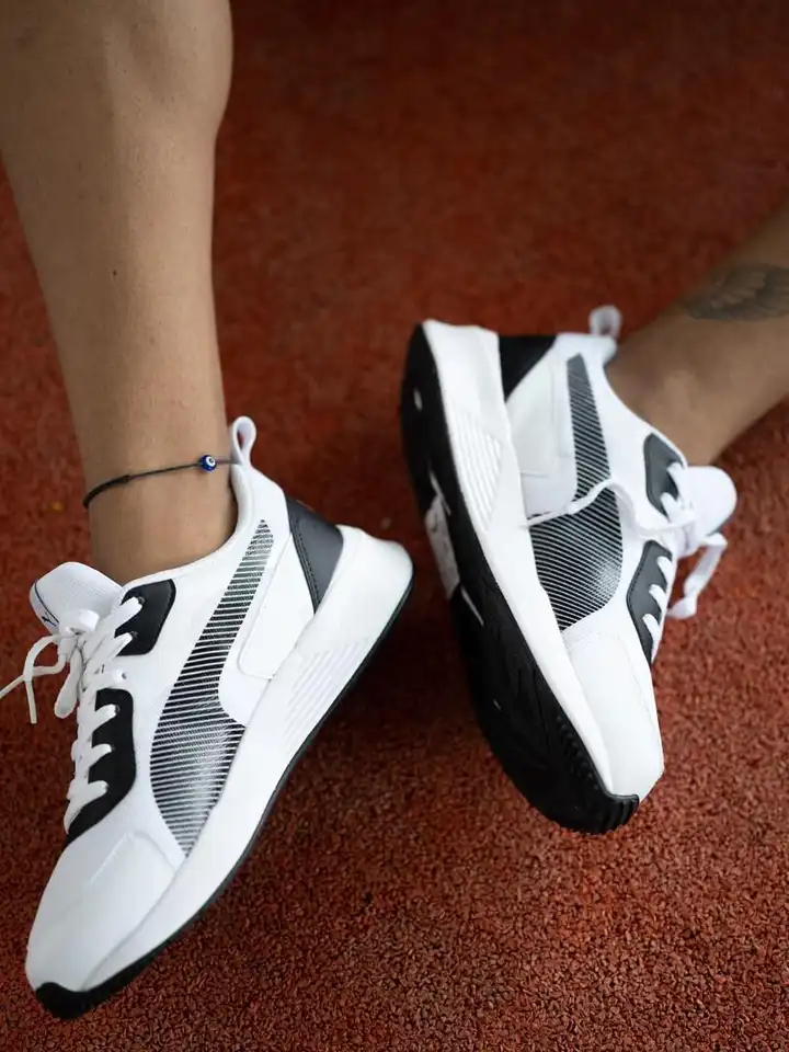 white and black puma shoes